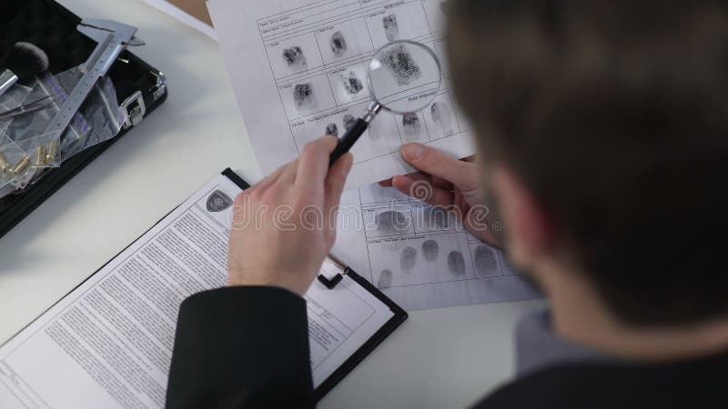 Detective Watching Fingerprints on Paper, Using Magnifying Glass ...
