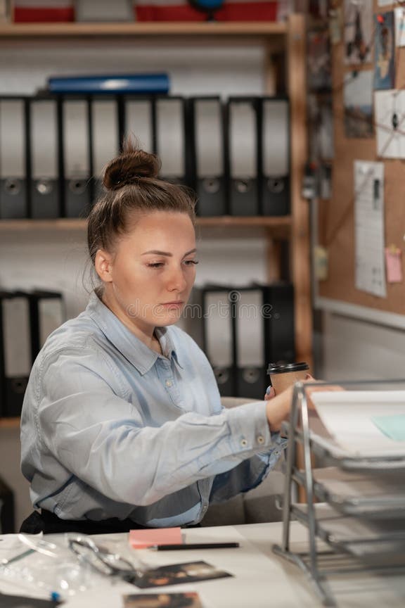 Detective Working at Desk in Her Office, Processing Evidence Stock ...