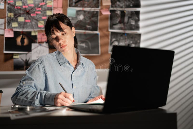 Detective Working at Desk in Her Office, Processing Evidence Stock ...
