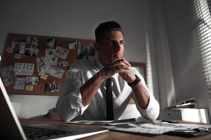 Detective Working at Desk in His Office Stock Photo - Image of board ...