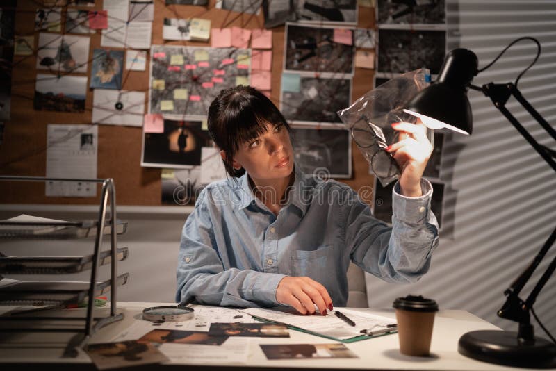 Detective Working in Her Office with Evidence Stock Photo - Image of ...
