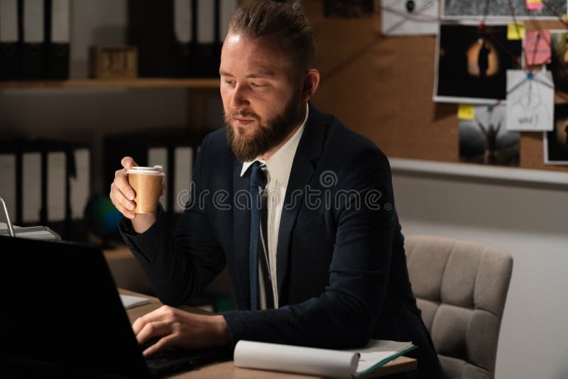 Detective Working in the Office Using a Computer, Process of Analyzing ...