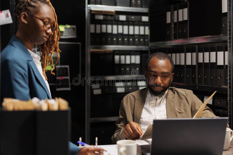 Detectives Analyzing Police Report File and Taking Notes Stock Photo ...
