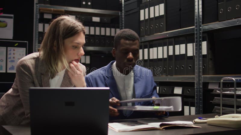 Detectives Collaborate To Solve Case Stock Footage - Video of documents ...