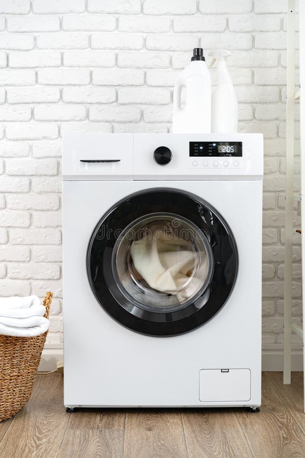 Detergent Bottle on Washing Machine in a Laundry Room Stock Photo ...