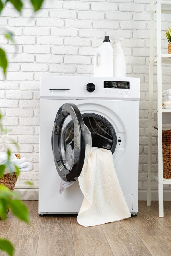 Detergent Bottle on Washing Machine in a Laundry Room Stock Photo ...
