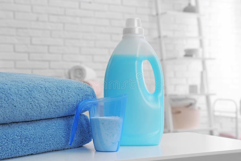 Detergents and Clean Towels on Table Indoors, Space for Text. Stock ...