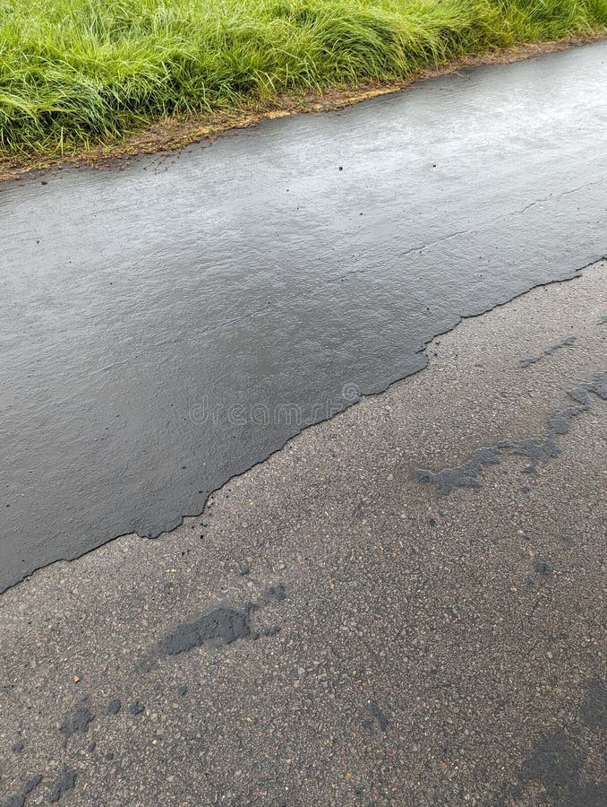 Deteriorating Asphalt and Concrete Road Surface in Wales Stock Photo ...