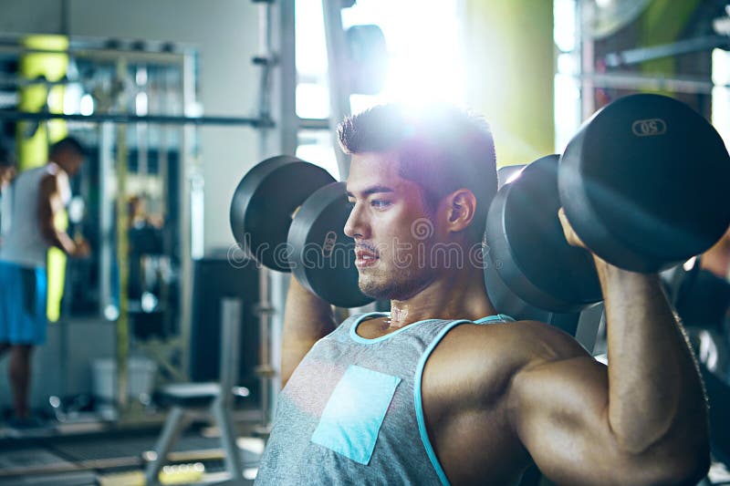 Determination is Key. a Man Doing a Upper-body Workout at the Gym ...
