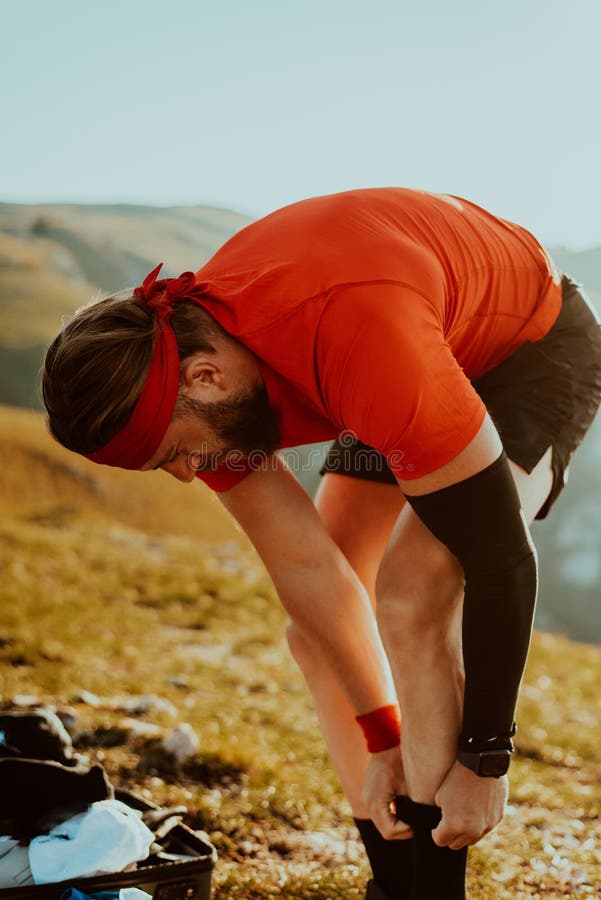 A Determined Athlete Preparing for the Start of Training on the Top of ...