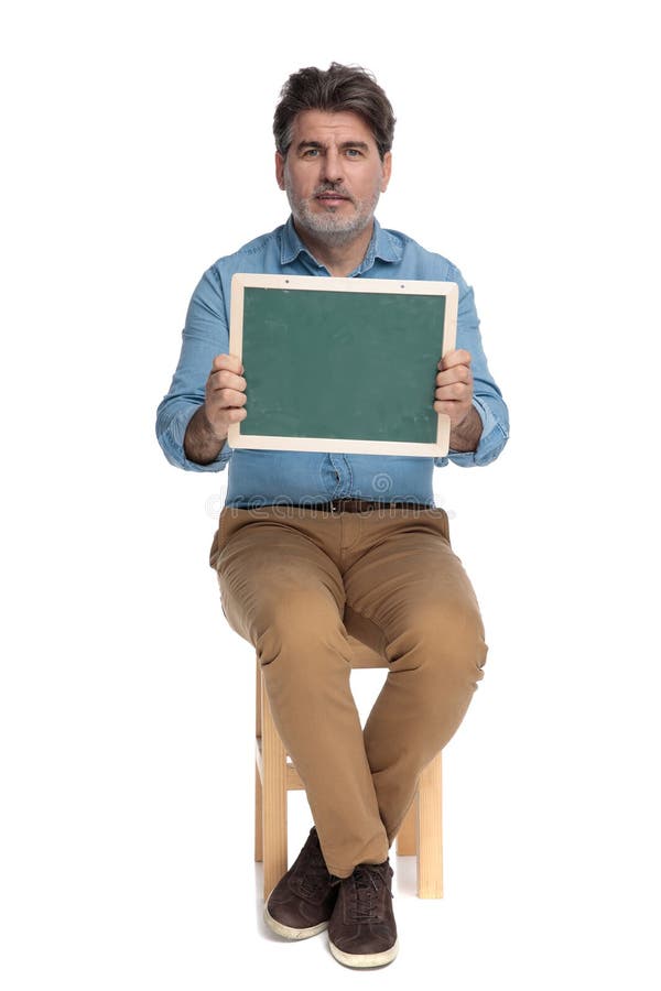 Determined Casual Man Posing and Wearing a Black Jeans Vest Stock Photo ...