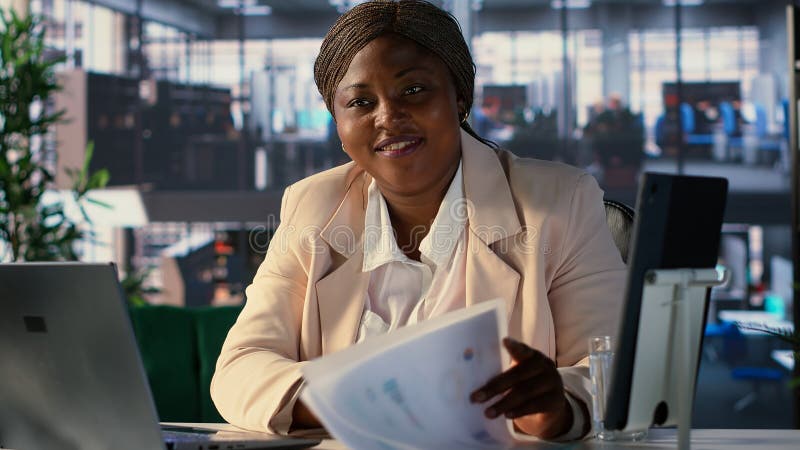 Determined Female CEO Analyzes Financial Reports and Develops a Growth ...