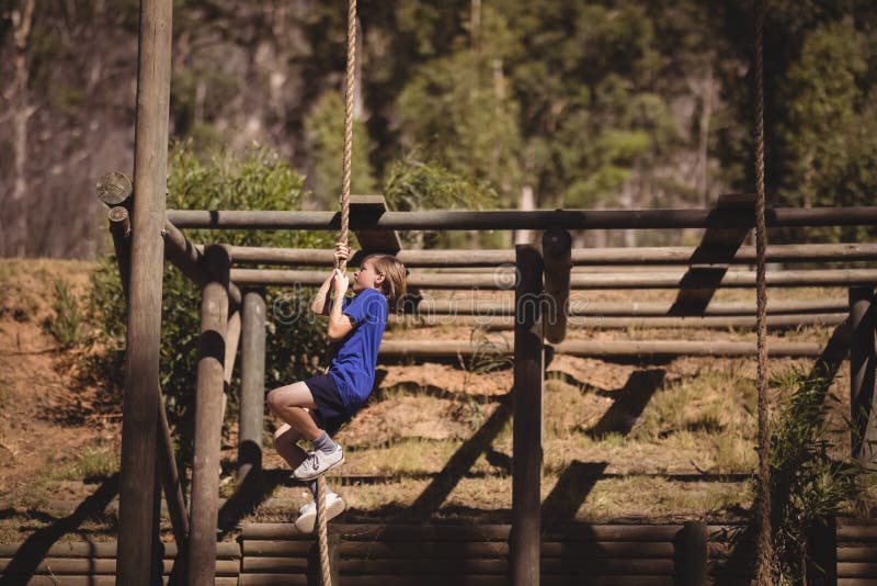 Determined Girl Climbing Rope during Obstacle Course Stock Image ...