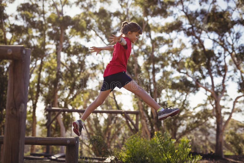 Determined Girl Climbing Rope during Obstacle Course Stock Image ...