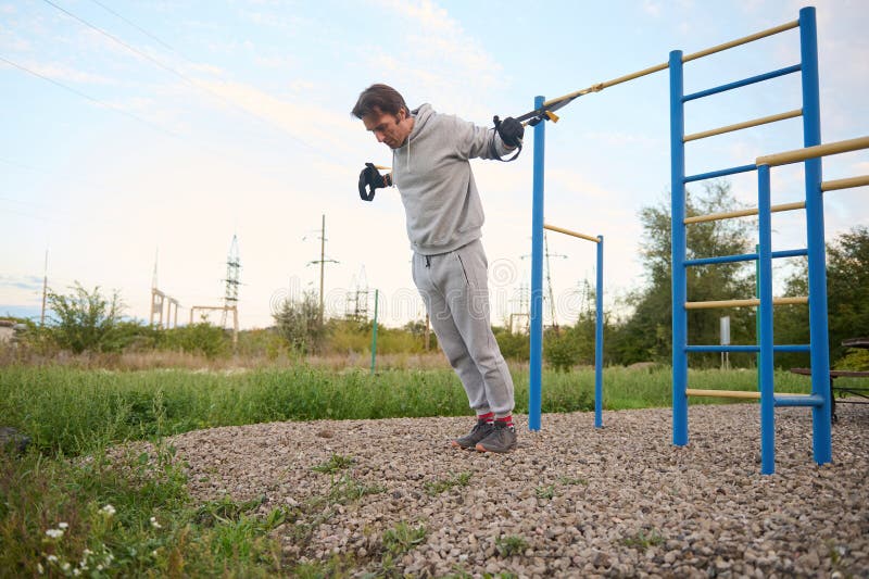 Determined Male Athlete Performs a Body Weight Training Using ...