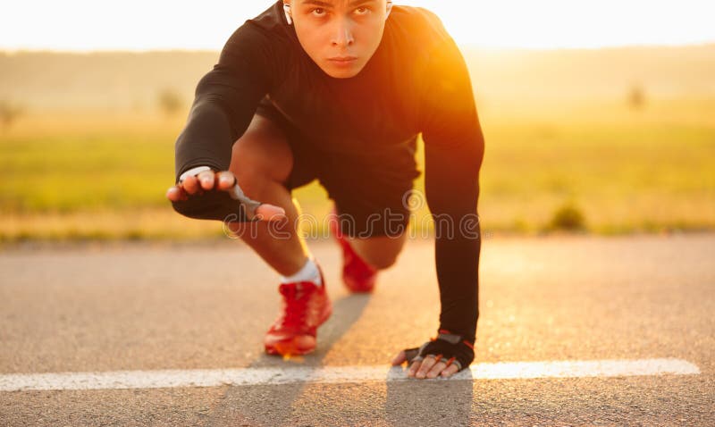 Determined Male Athlete Standing in Crouch Start Position and Getting ...