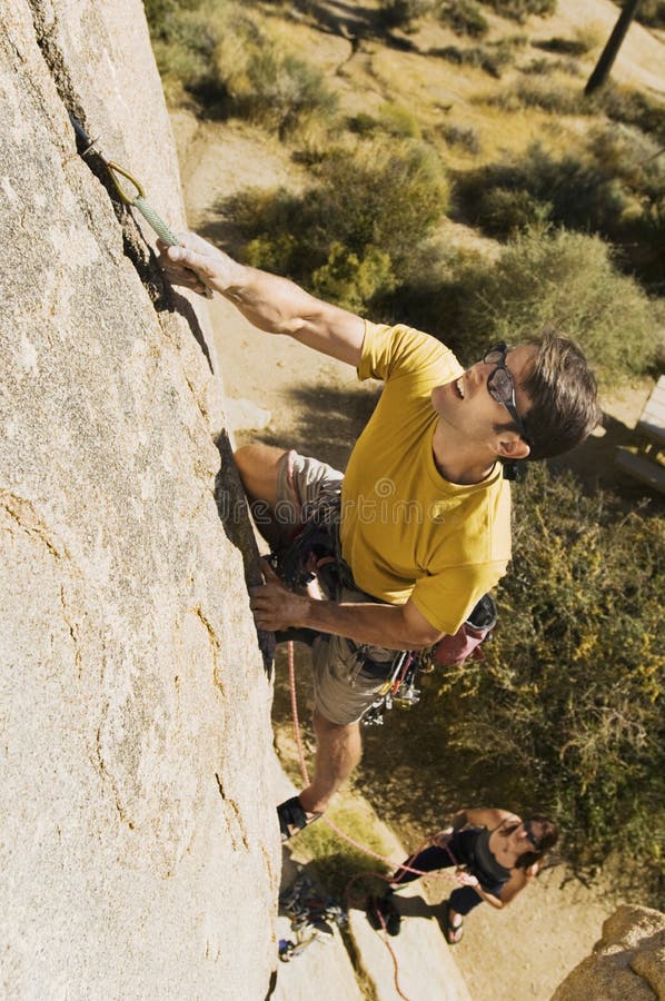 Determined Man Climbing Rock Stock Photo - Image of california, cliff ...