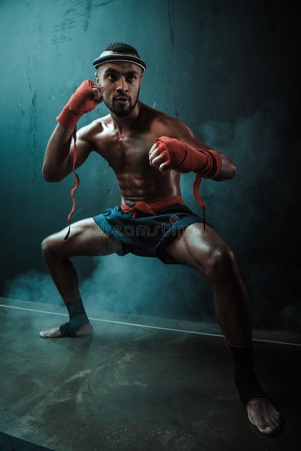 Determined Muay Thai Fighter Training Thai Boxing and Looking Away ...