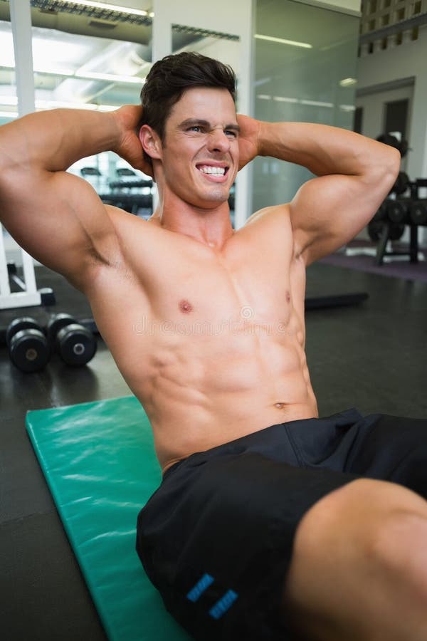Determined Muscular Man Doing Abdominal Crunches Stock Image - Image of ...