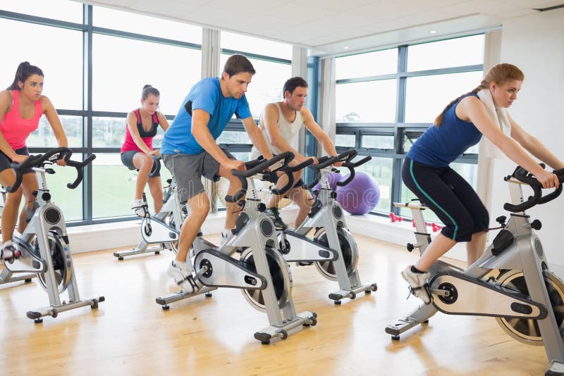 Determined People Working Out at Spinning Class Stock Image - Image of ...