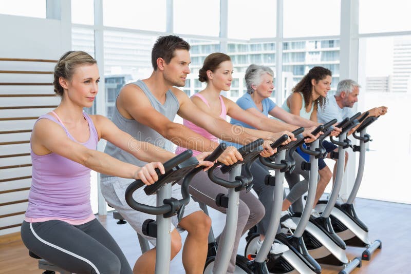 Determined People Working Out at Spinning Class Stock Image - Image of ...