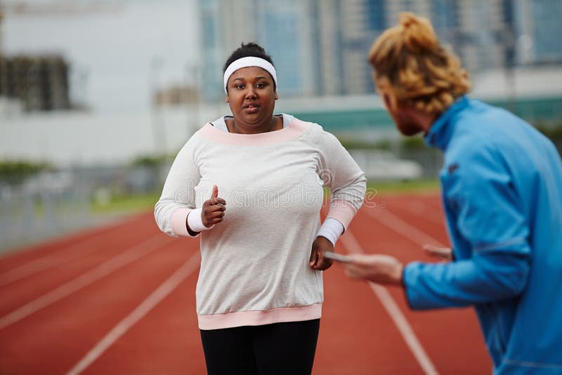 Determined Plus-size Woman Running on Track Stock Image - Image of ...