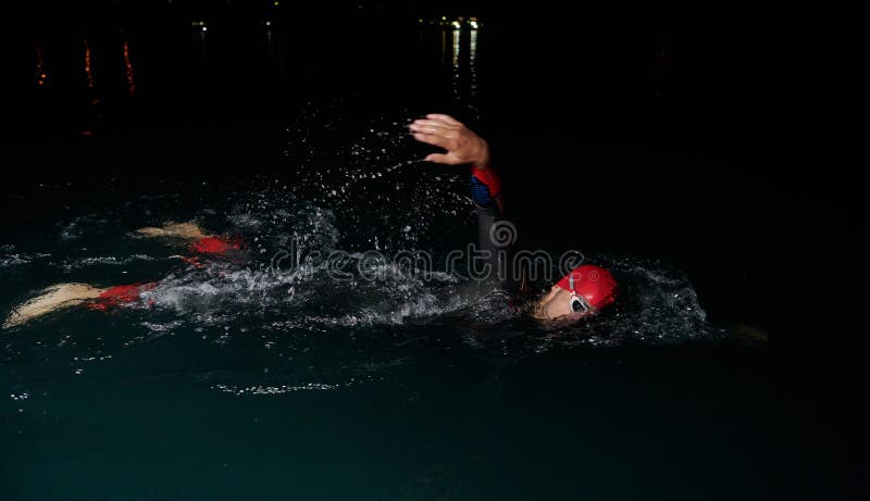 A Determined Professional Triathlete Undergoes Rigorous Night Time ...