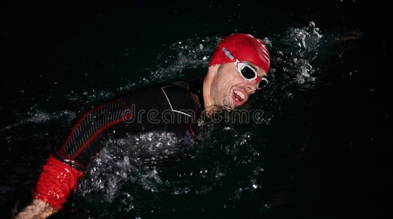 A Determined Professional Triathlete Undergoes Rigorous Night Time ...