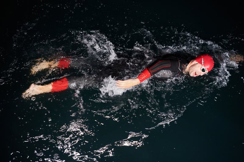A Determined Professional Triathlete Undergoes Rigorous Night Time ...