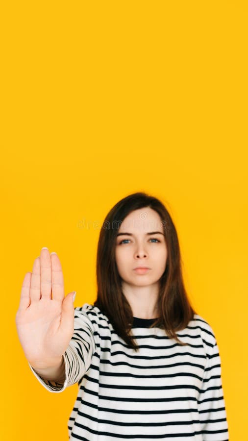 Determined Woman Making Stand: Serious Lady with Confident Expression ...