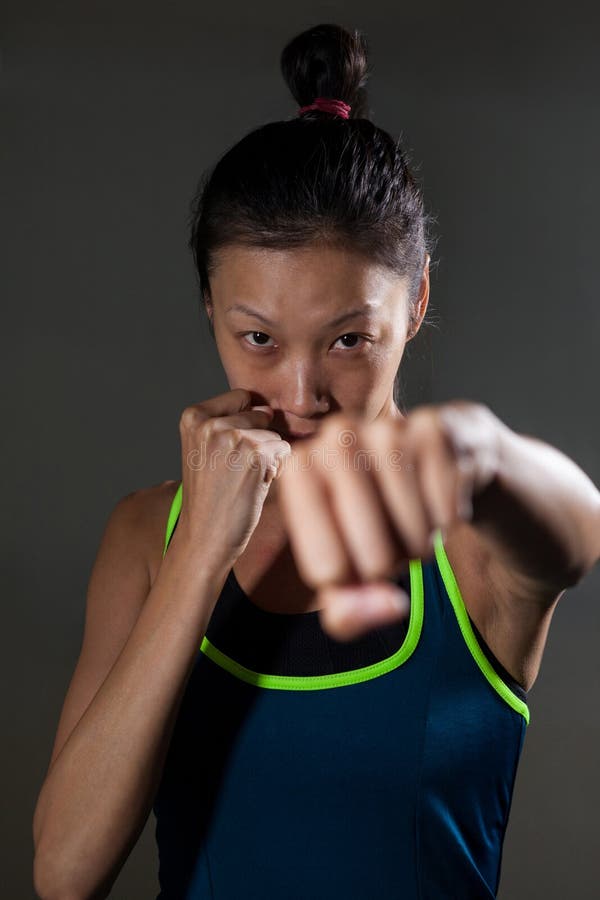 Determined Woman Practicing Boxing in Fitness Studio Stock Photo ...