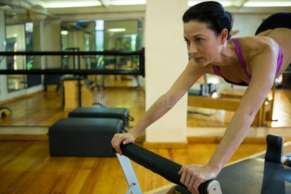 Determined Woman Practicing Stretching Exercise Stock Photo - Image of ...