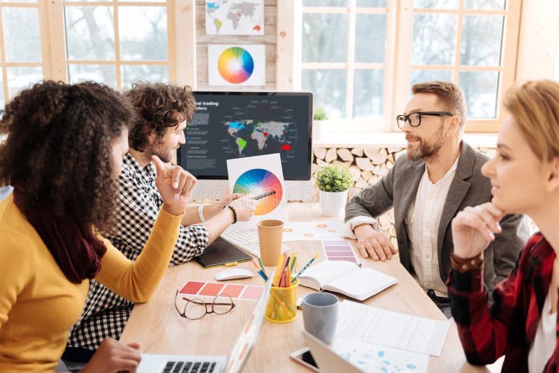 Determined Workers Discussing Work in the Office Stock Image - Image of ...