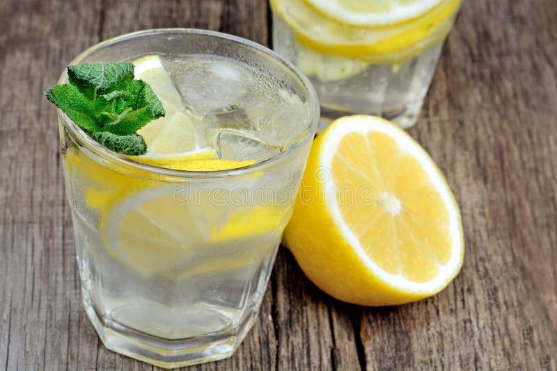 Detox Water with Fresh Lemon and Mint on Table Stock Image - Image of ...