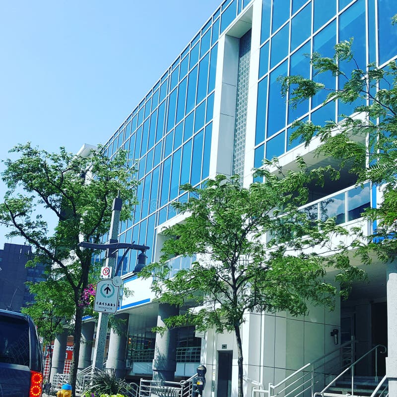 Blue glass building editorial stock image. Image of blue - 128684574