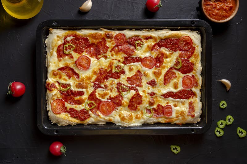 Detroit-style Pizza. Square Pepperoni Pizza with Sauce Stock Photo ...