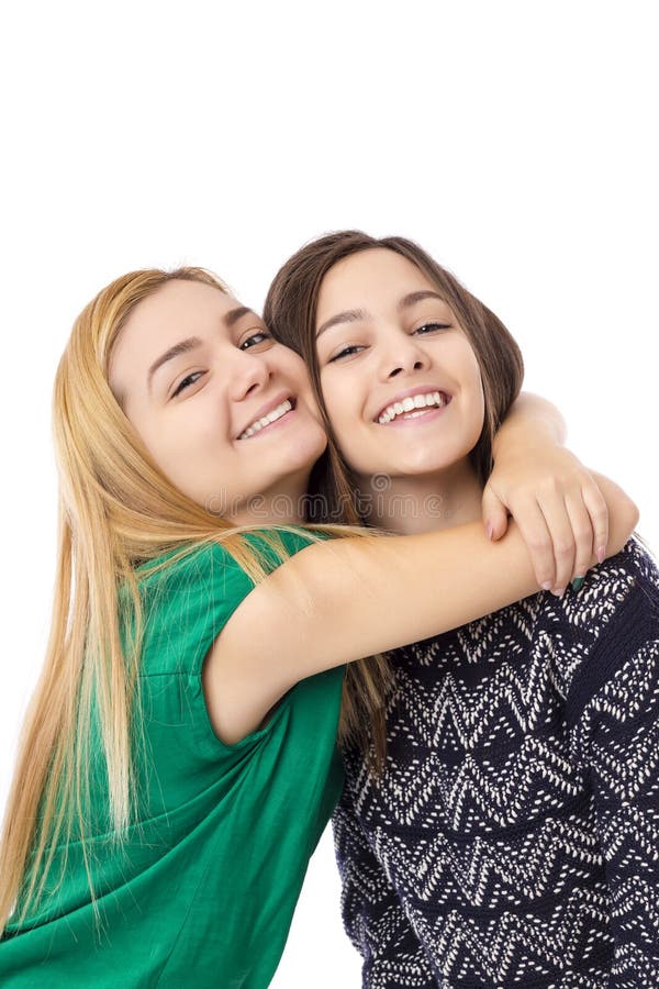Deux Adolescentes Attirantes De Sourire Blondes Et Brune Photo Stock