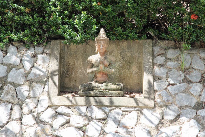 Deva Statue on Concrete Wall Stock Image - Image of green, rock: 261796241