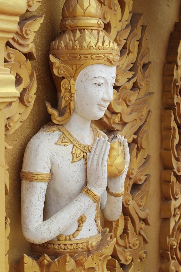 Deva statue in the temple stock photo. Image of traditional - 221734210