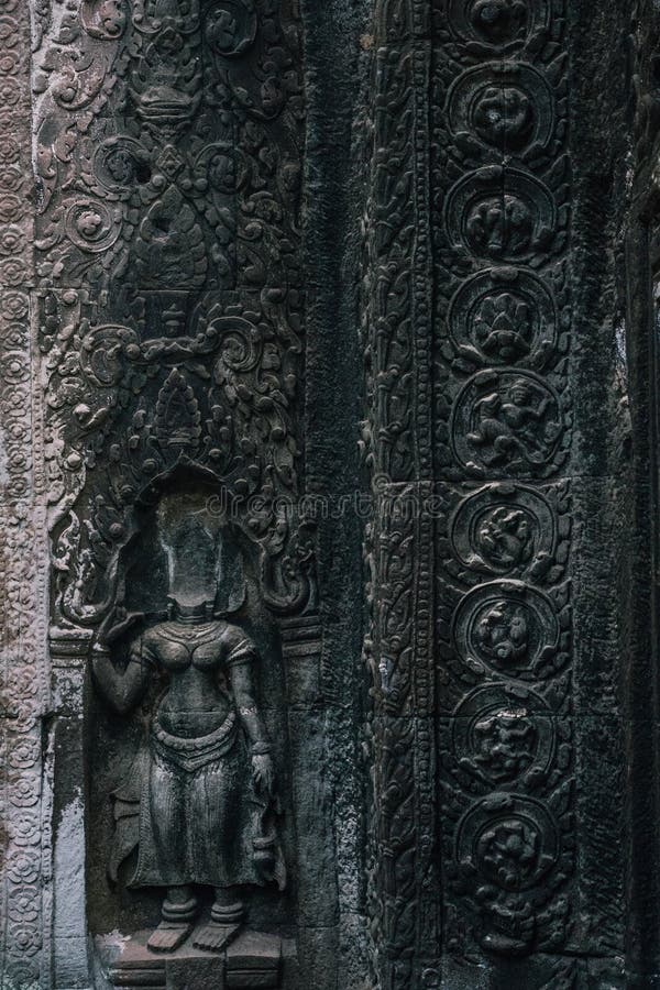Devata Sculpture without Head in Ta Prohm Temple at Angkor Complex ...