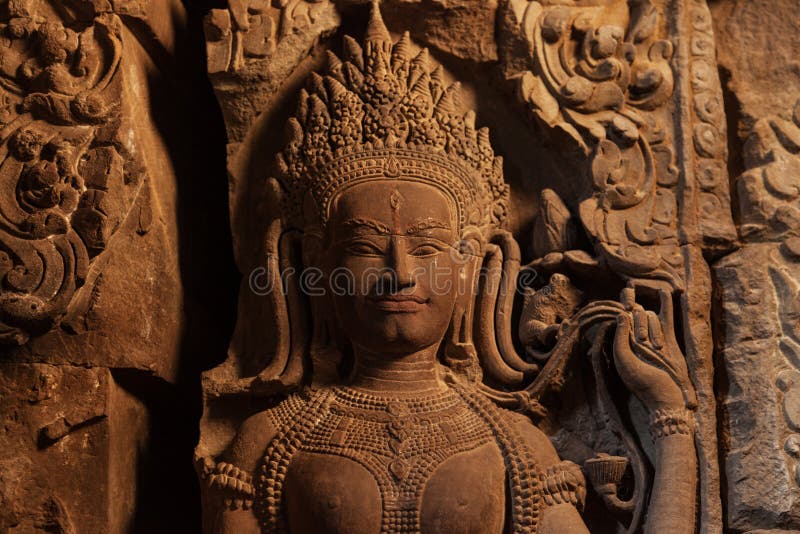 Devata statue in Ta Phrom stock photo. Image of buddhism - 75624850