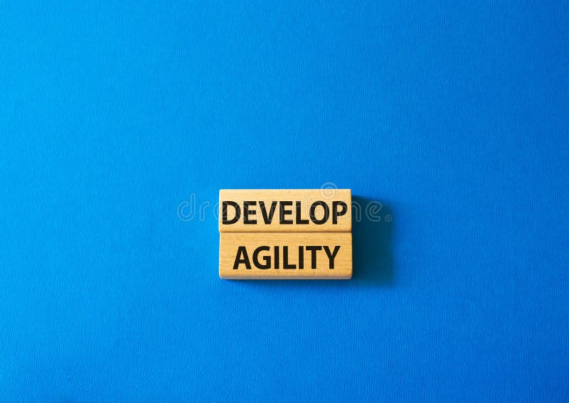 Develop Agility Symbol. Concept Word Develop Agility on Wooden Blocks ...