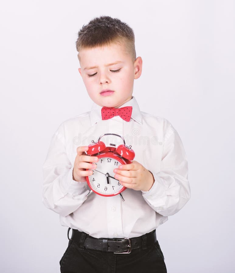 Develop Self Discipline. Set Up Alarm Clock. Child Little Boy Hold Red ...