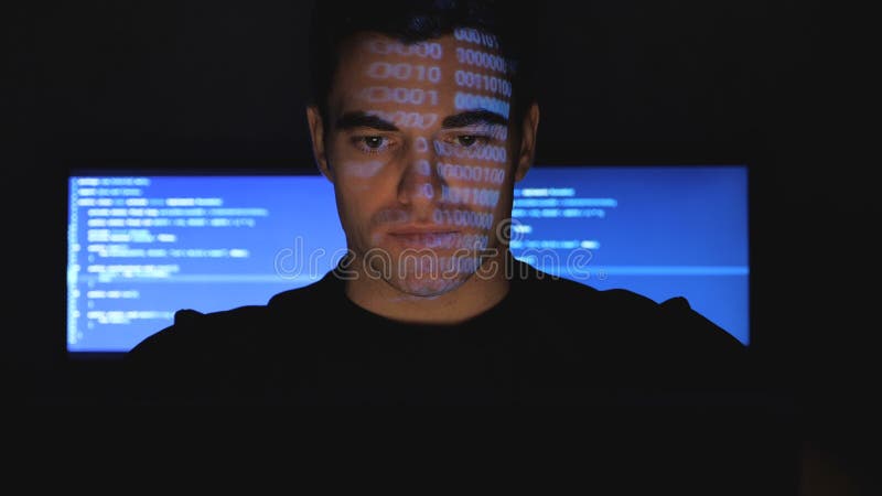 Developer Hacker Programmer Working On Computer In A Data Center While Blue Code Characters