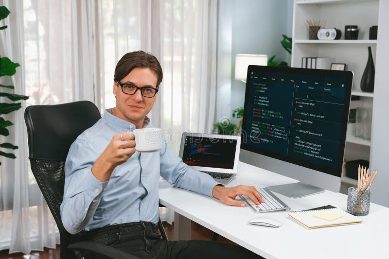 It Developer Looking Camera, Holding Coffee Cup with Coding on Pc ...