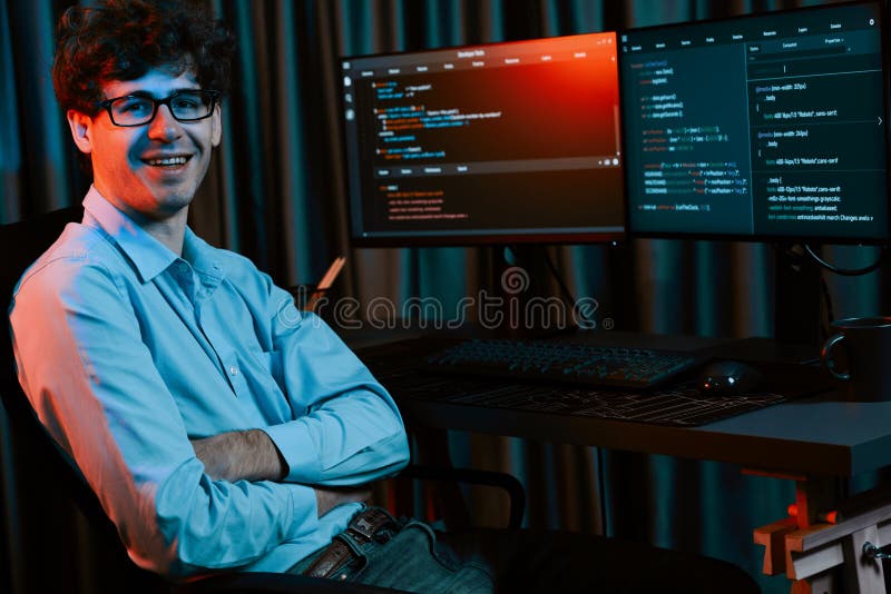 It Developer Looking at Camera with Software Development Information ...