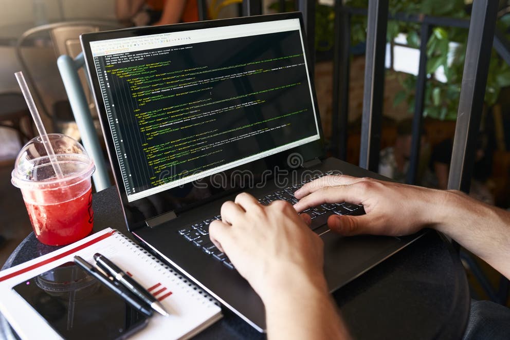 Developer Programmer with Laptop. Program Code and Script Data on Screen. Young Freelancer in ...