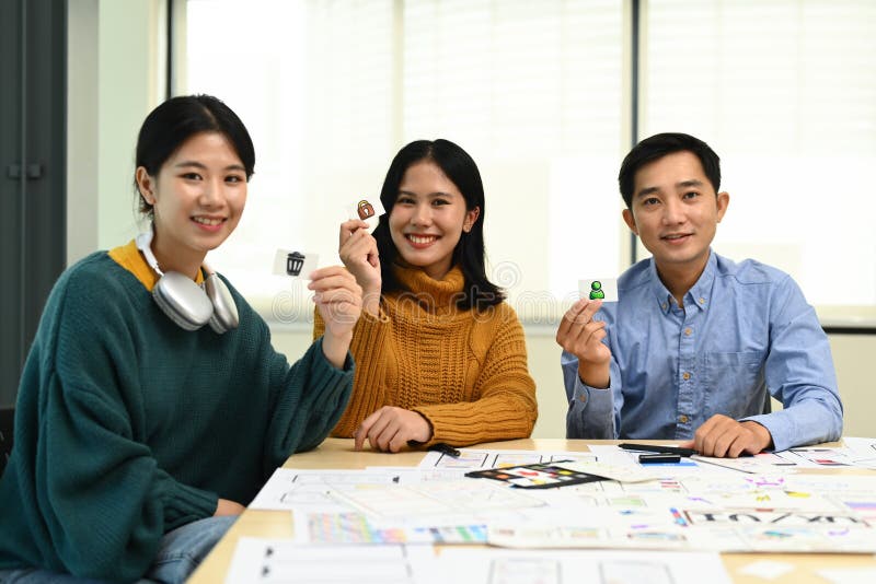 Developer Team Collaborating and Planning Template Layout for Mobile ...