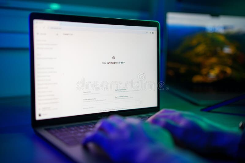 Developer Working with ChatGPT AI Chatbot on Laptop Computer Screen ...