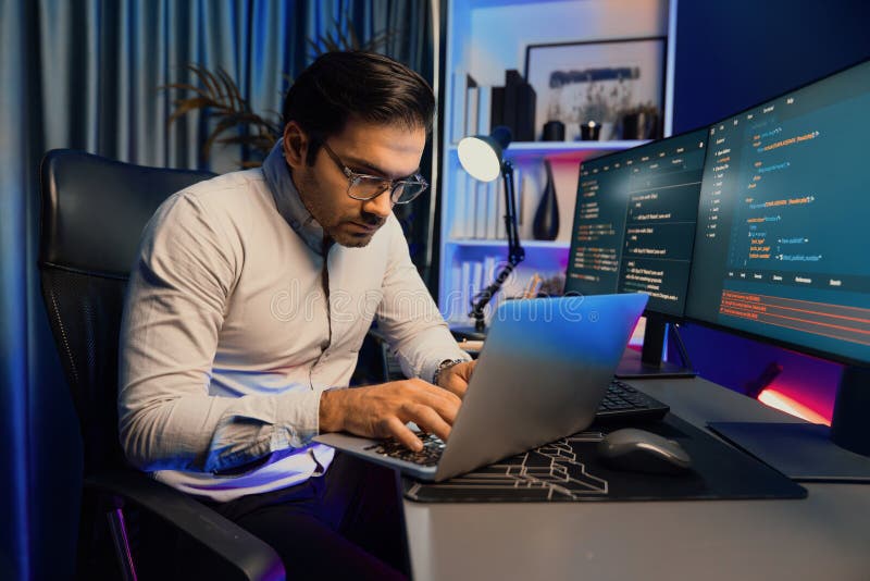 It Developer Working Laptop To Search Code System at Neon Light Office ...